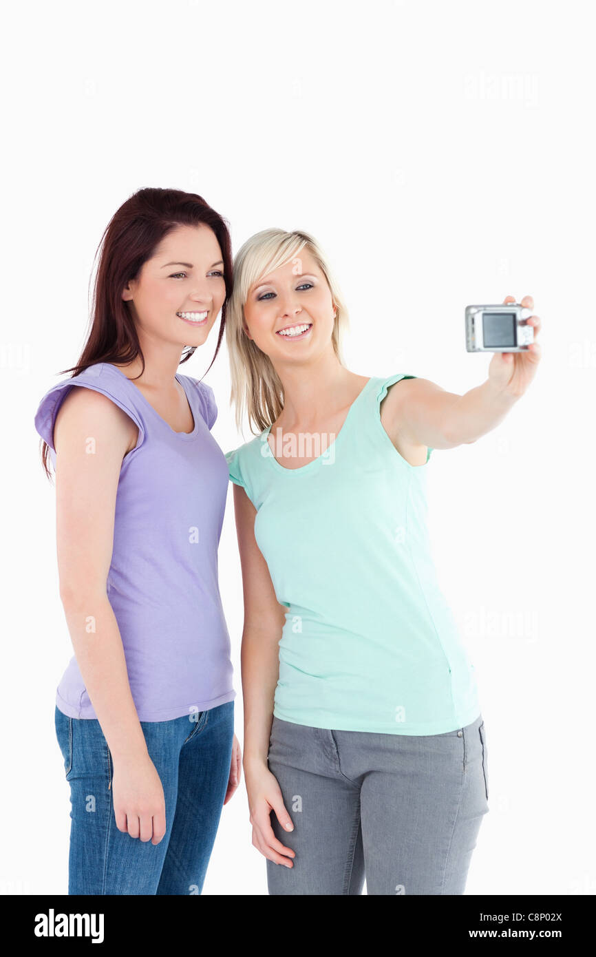 Smiling women with a camera Stock Photo - Alamy