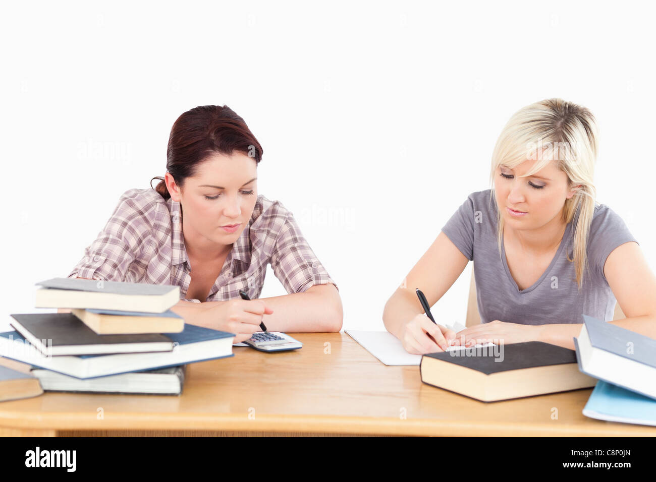 Cute students doing homework Stock Photo - Alamy