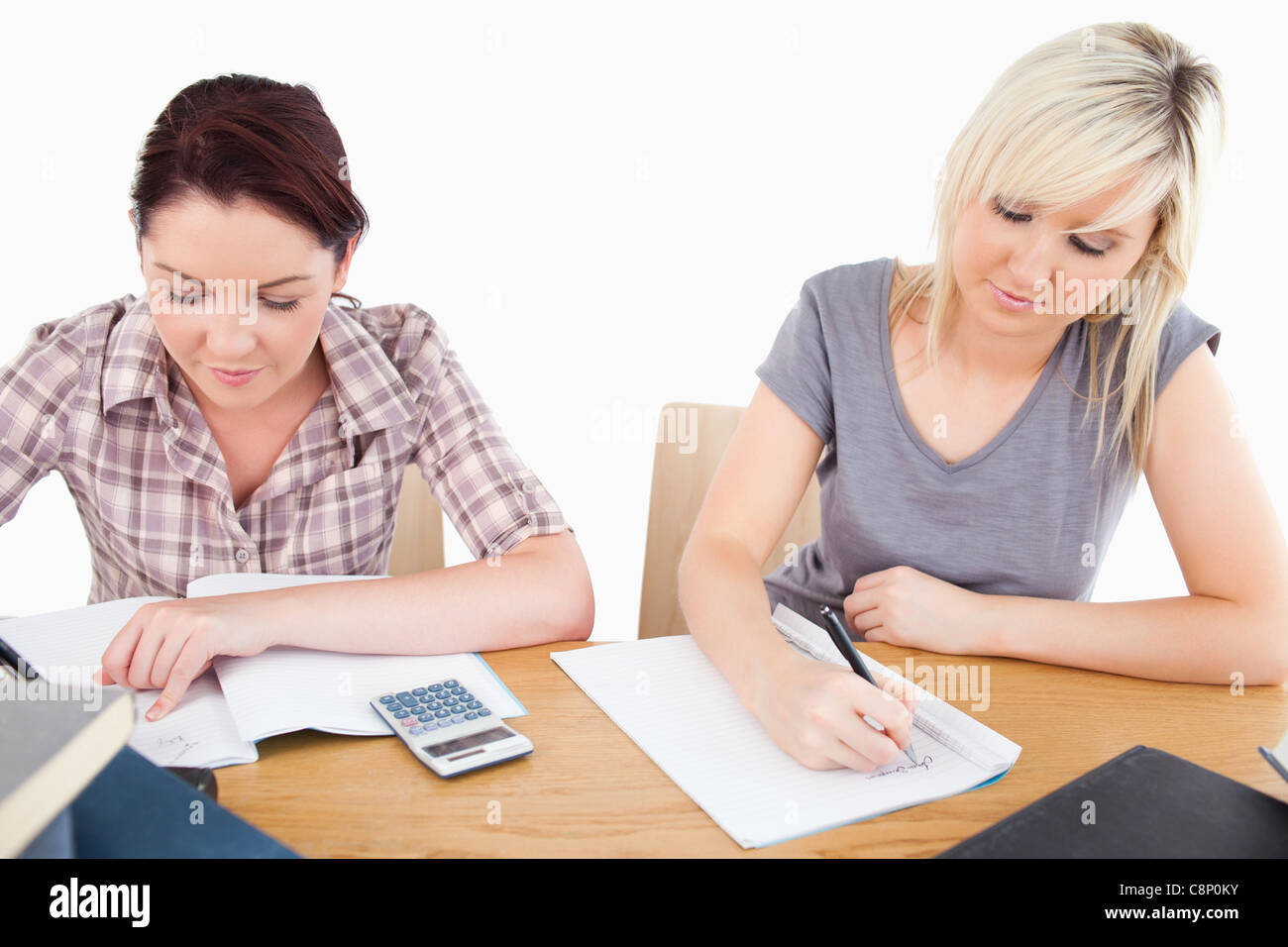 Lovely women doing their homework Stock Photo - Alamy