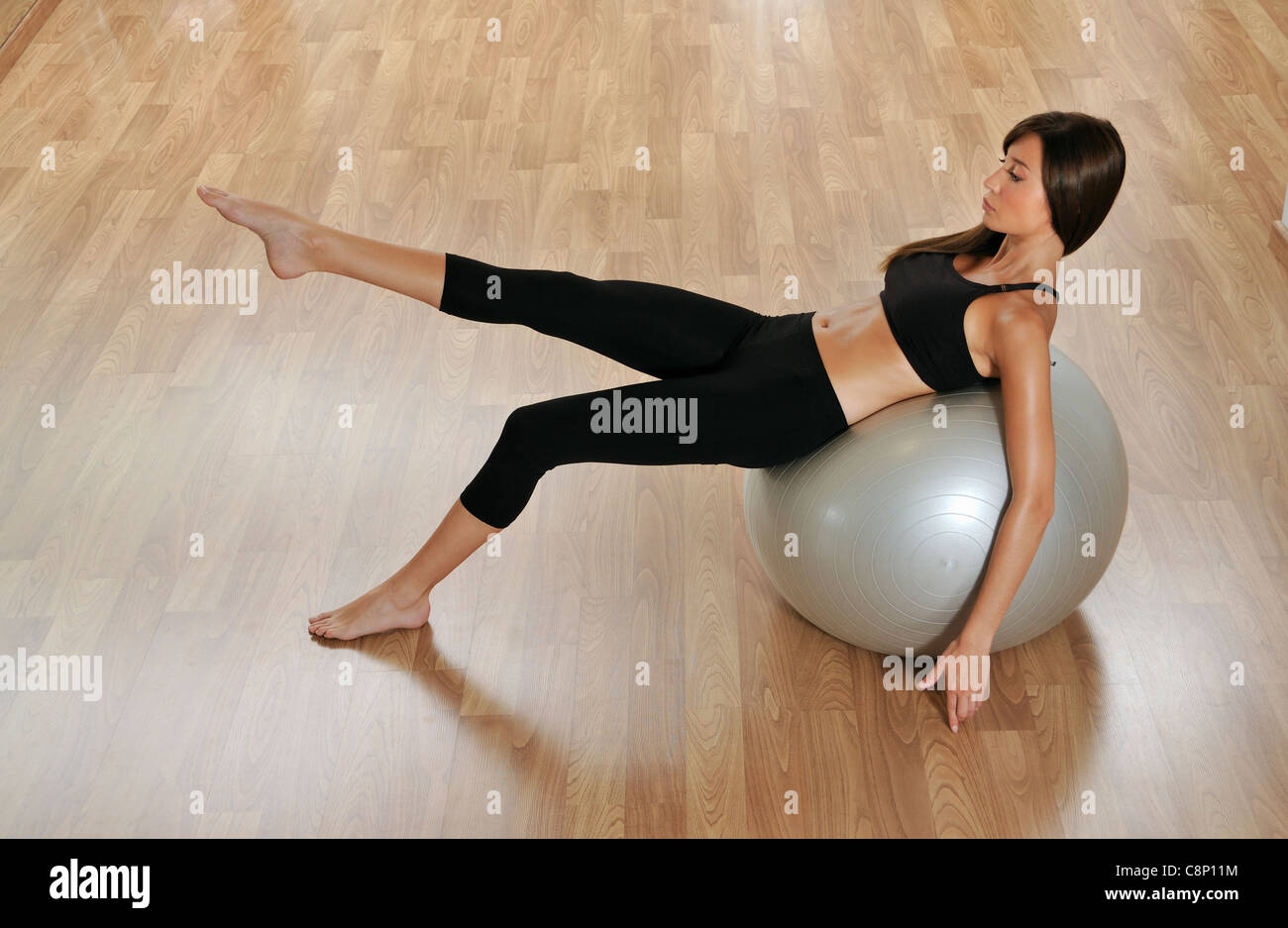 Young woman doing exercise with pilates fitball Stock Photo - Alamy