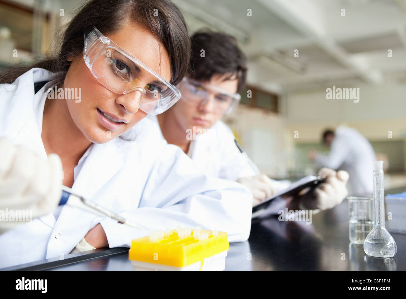 Two scientists making an experiment Stock Photo - Alamy