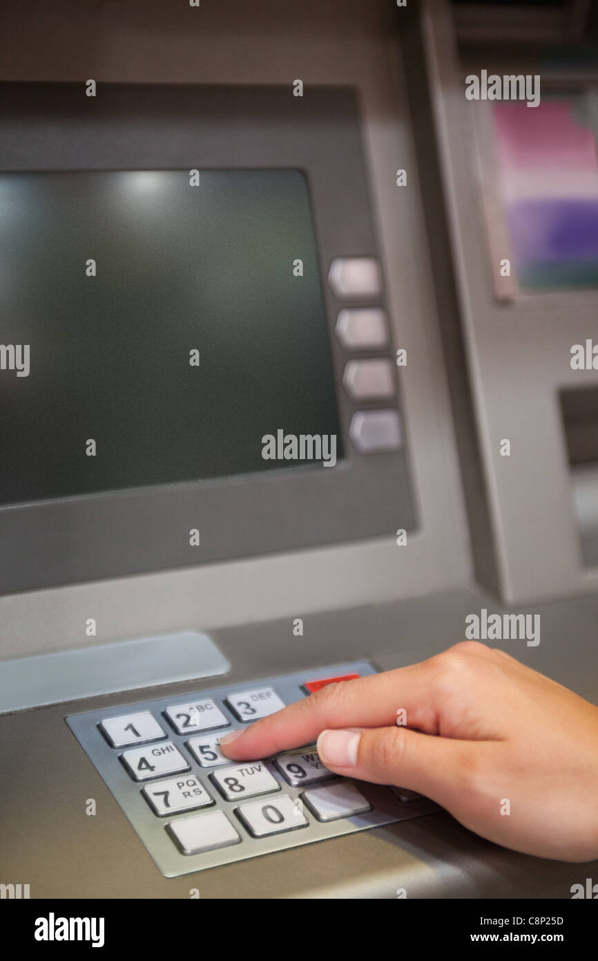 Portrait of a hand typing a PIN code Stock Photo - Alamy