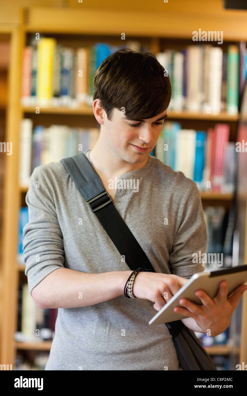 Portrait of a young student using a tablet computer Stock Photo - Alamy