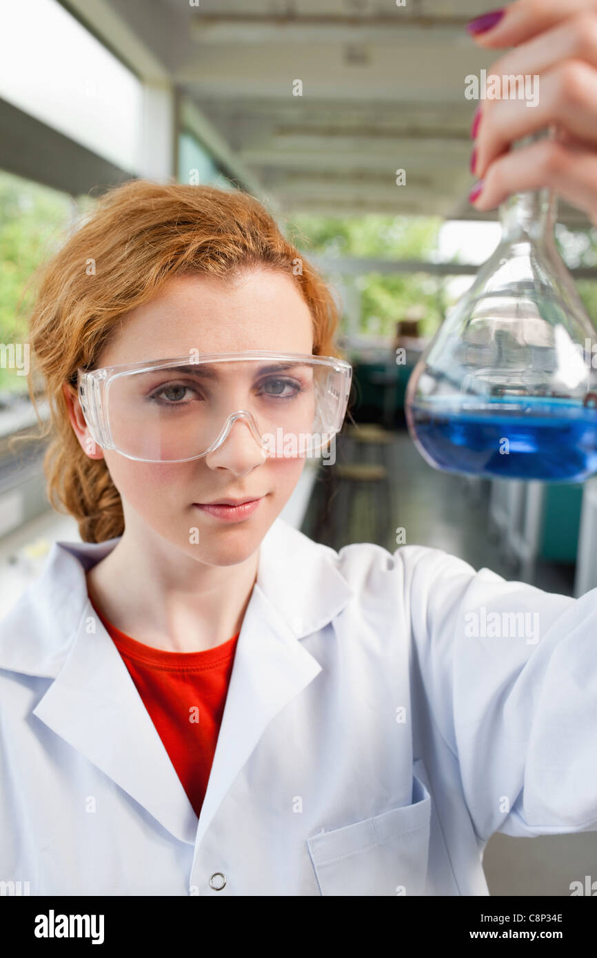 Portrait of a science student holding a flask Stock Photo - Alamy