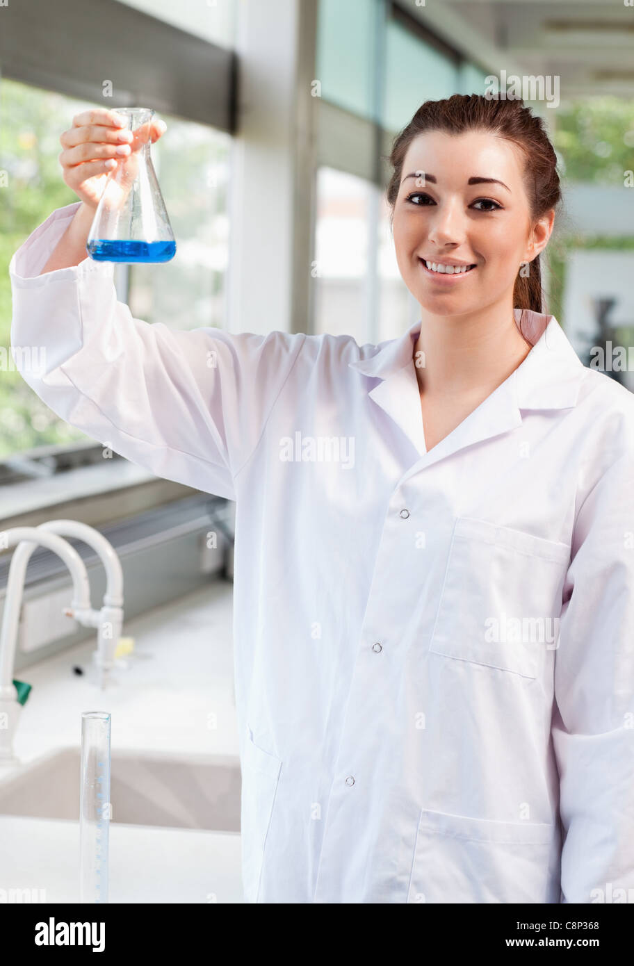 Portrait of a science student holding an Erlemeyer flask Stock Photo ...