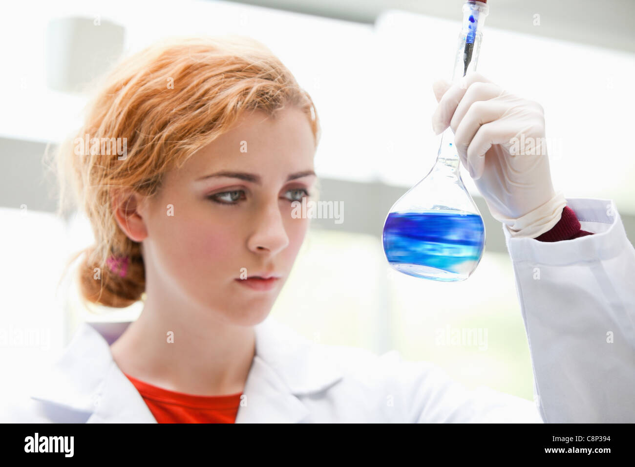 Scientist mixing chemical fluid hi-res stock photography and images - Alamy
