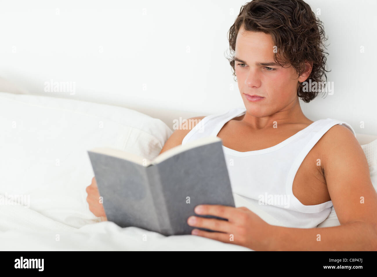 Man reading a book Stock Photo - Alamy