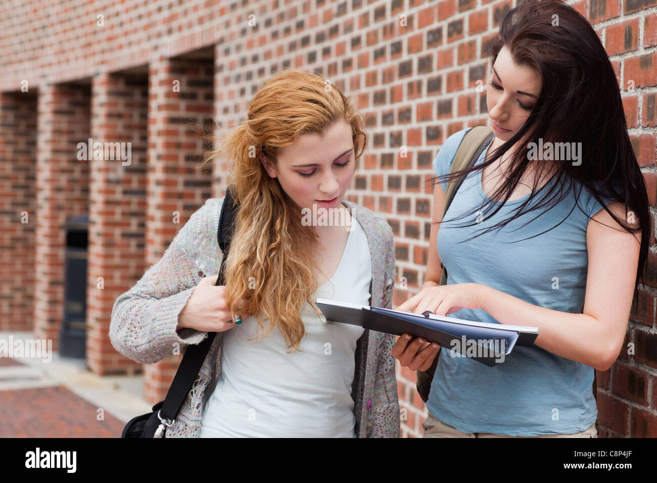 Standing student pointing bag hi-res stock photography and images - Alamy
