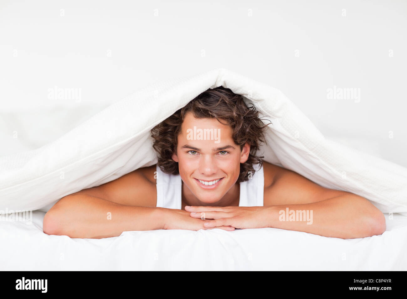 Man looking under bed sheet hi-res stock photography and images - Alamy