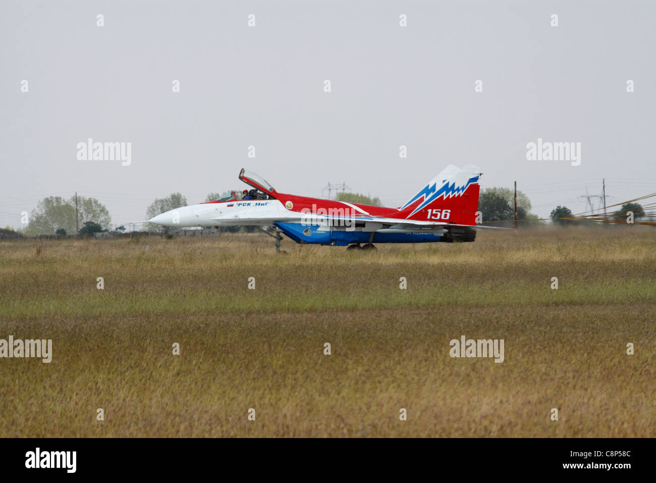 Russian MiG-29M fighter plane in white-blue-red air show colors on the ...