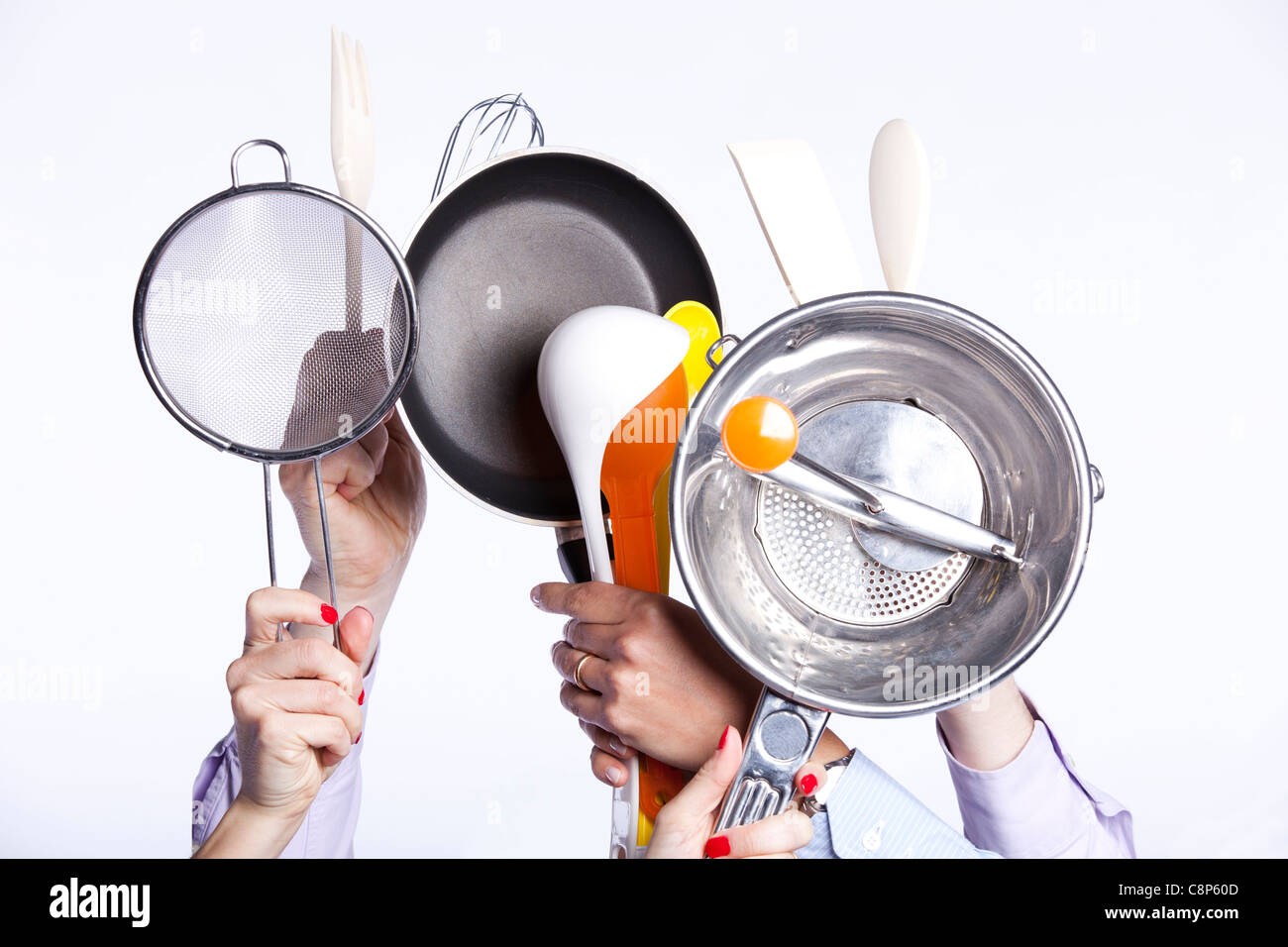 Group of people hands holding some kitchenware tools (selective focus ...