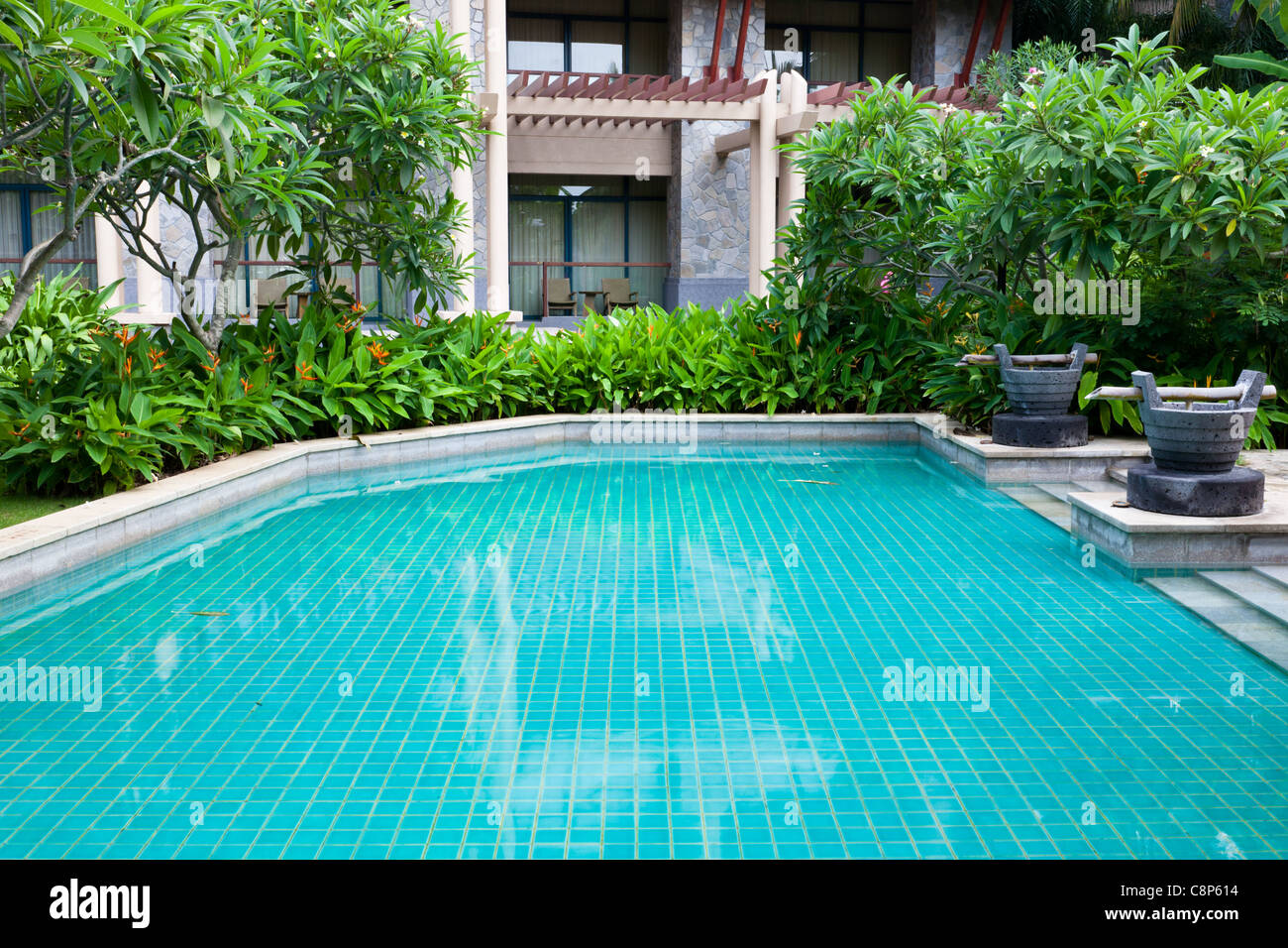swimming pool in hotel backyard Stock Photo - Alamy