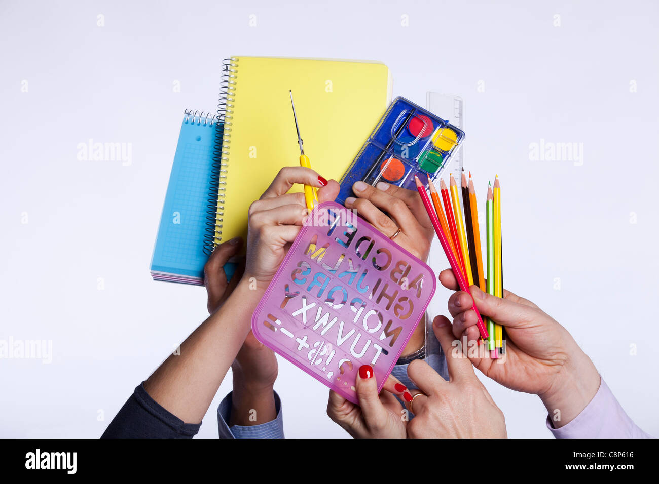 Group of hands holding education objects (selective focus Stock Photo ...
