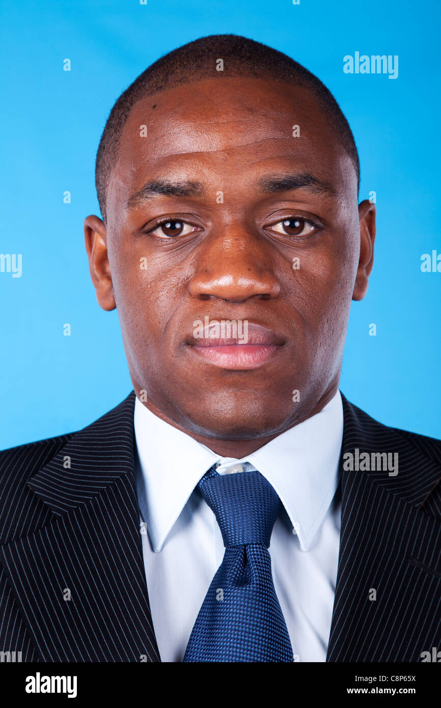 African businessman portrait (blue background Stock Photo - Alamy