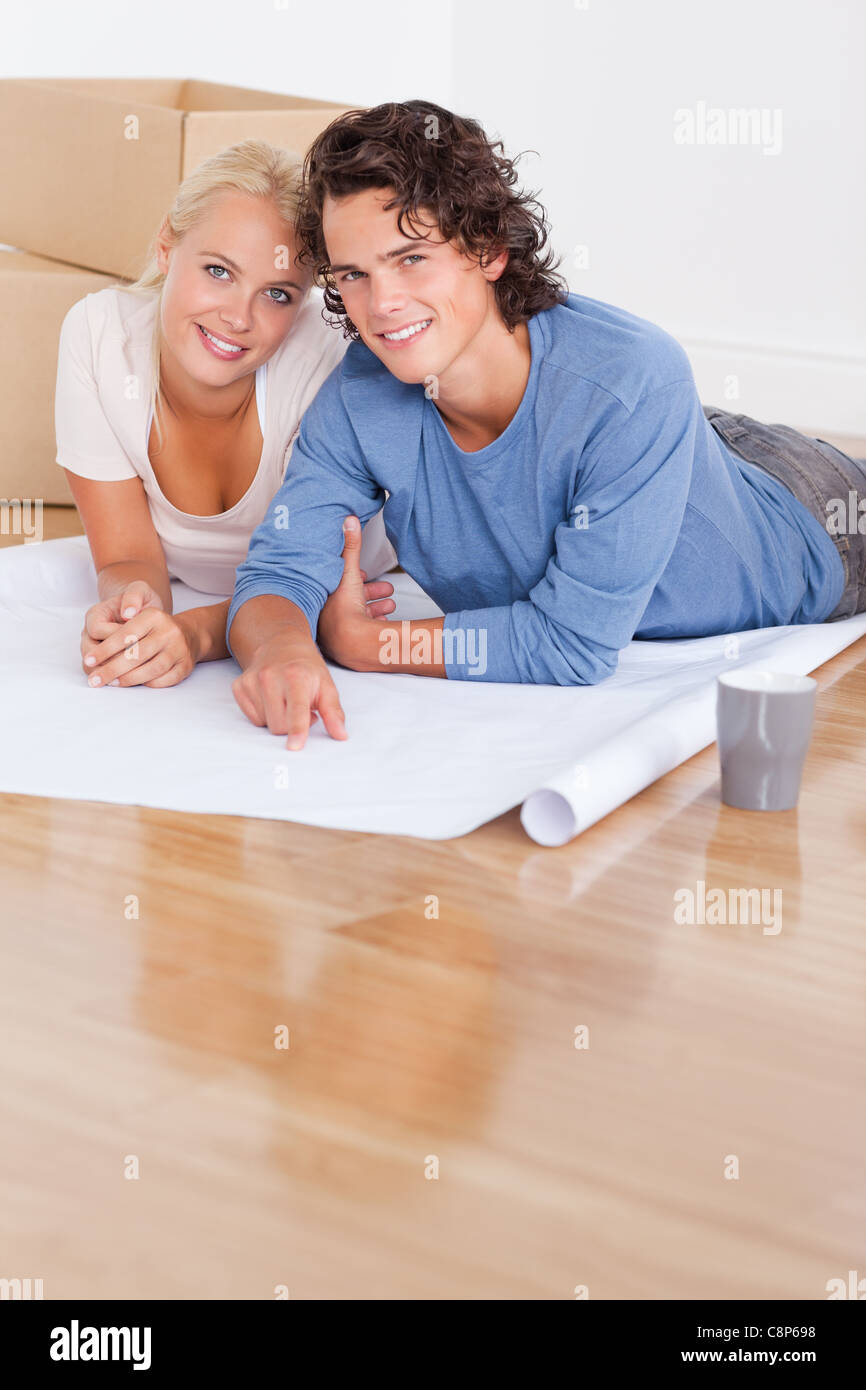 Portrait of a couple getting ready to move in a new house Stock Photo ...