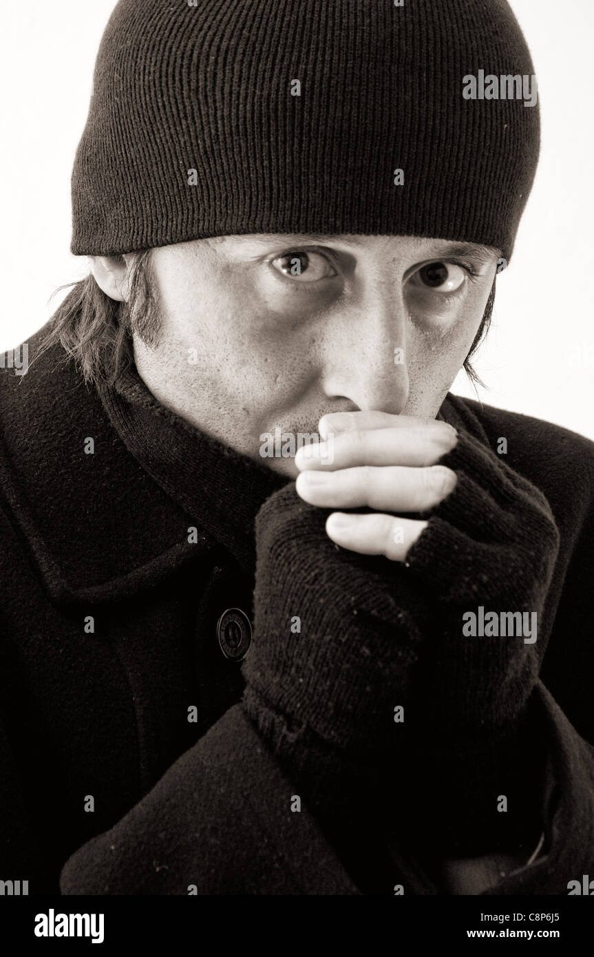 Homeless man in the cold, monochromatic image Stock Photo - Alamy