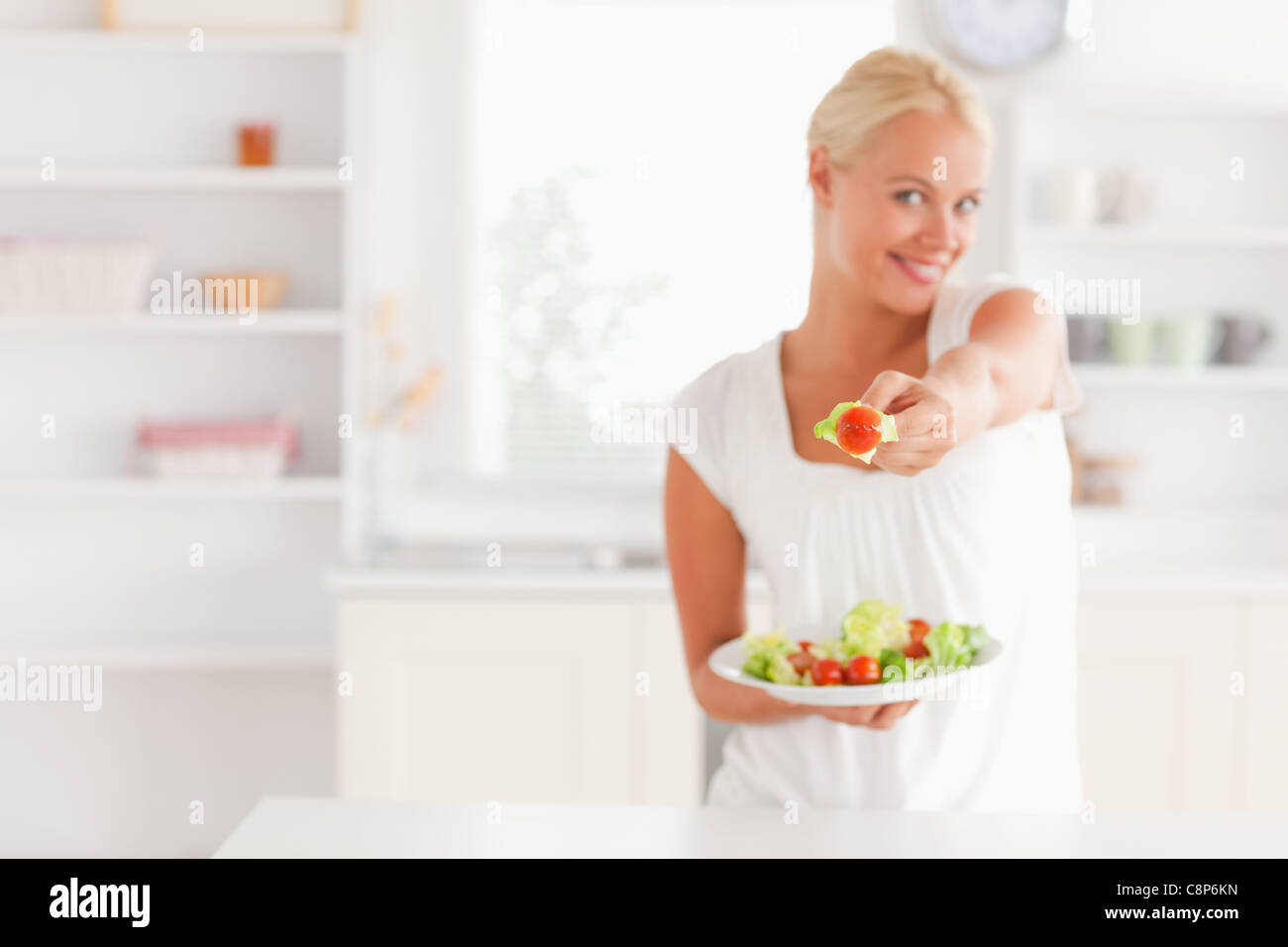 Happy female giving tomato hi-res stock photography and images - Alamy