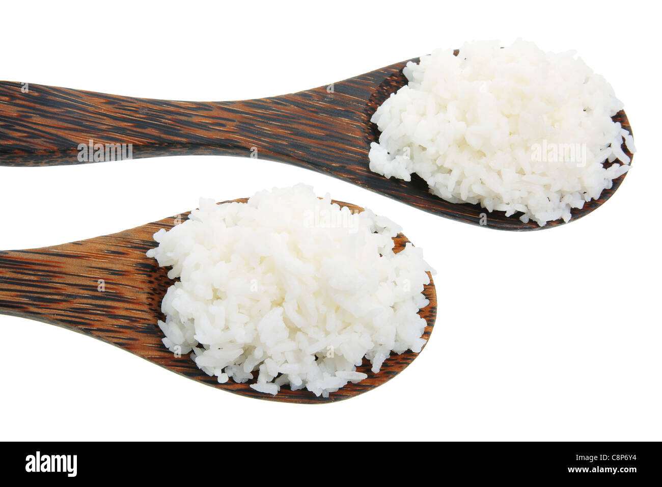Wooden Spoons with Cooked Rice Stock Photo - Alamy