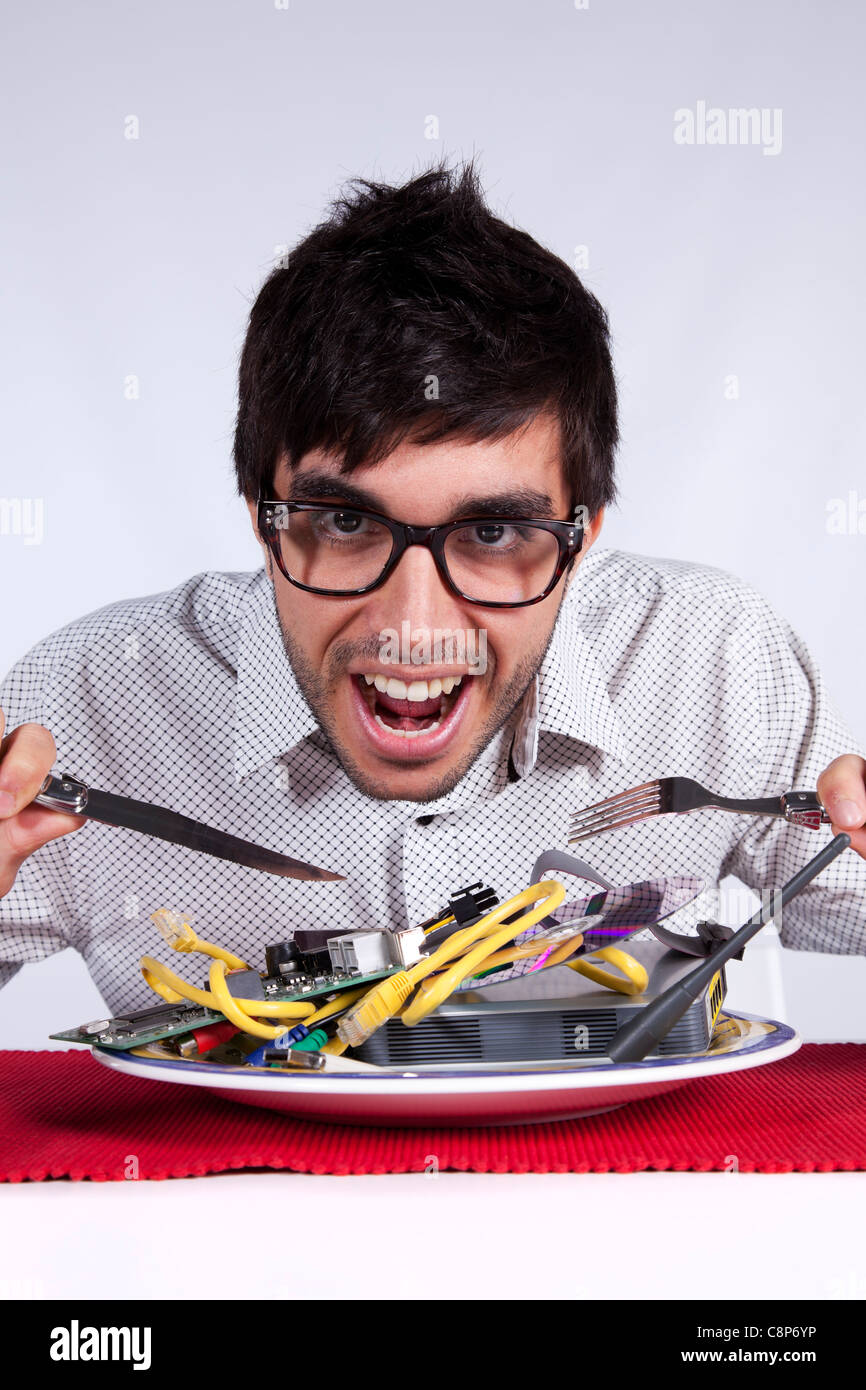 Crazy young man eating technology hi-res stock photography and images ...