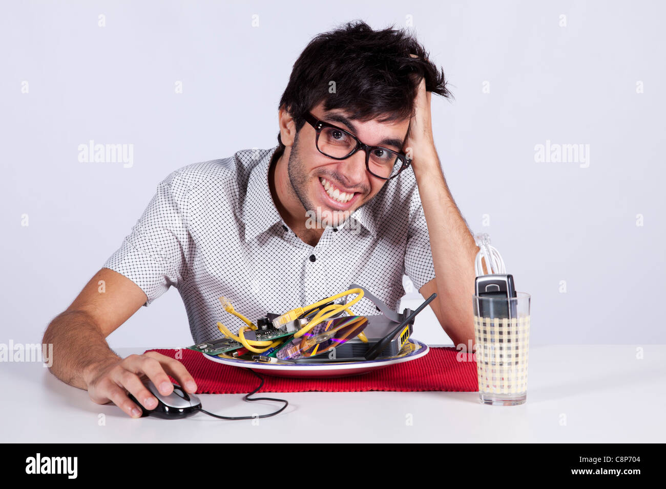 Crazy young man eating technology hi-res stock photography and images ...