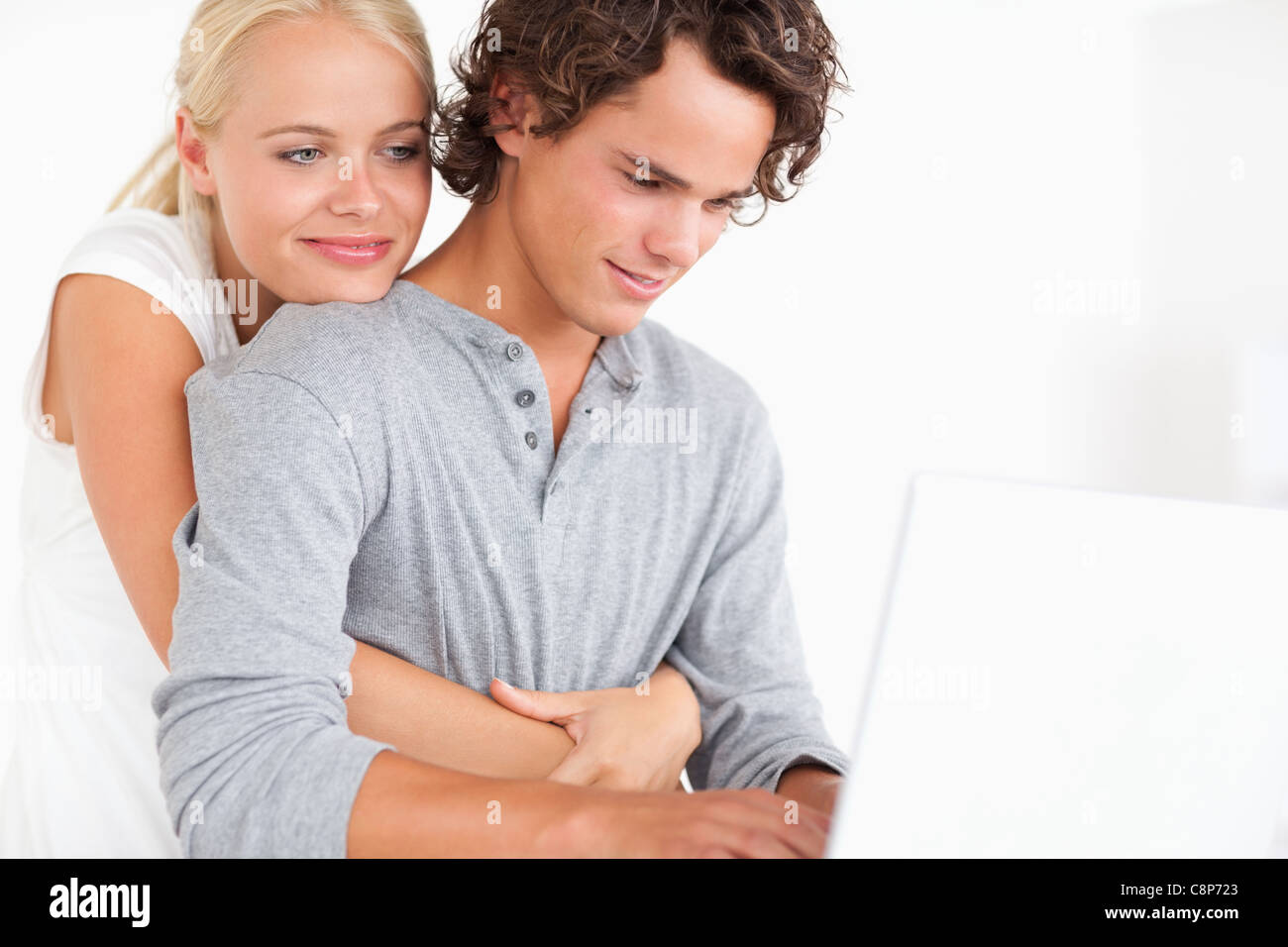 Close up of a couple using a notebook Stock Photo - Alamy