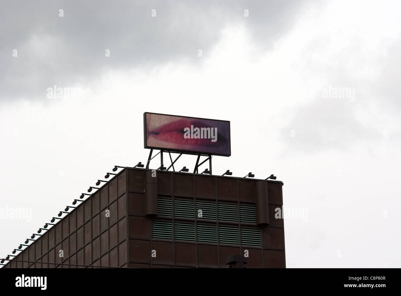 Funny billboard ads on top of building showing woman lips Stock Photo ...