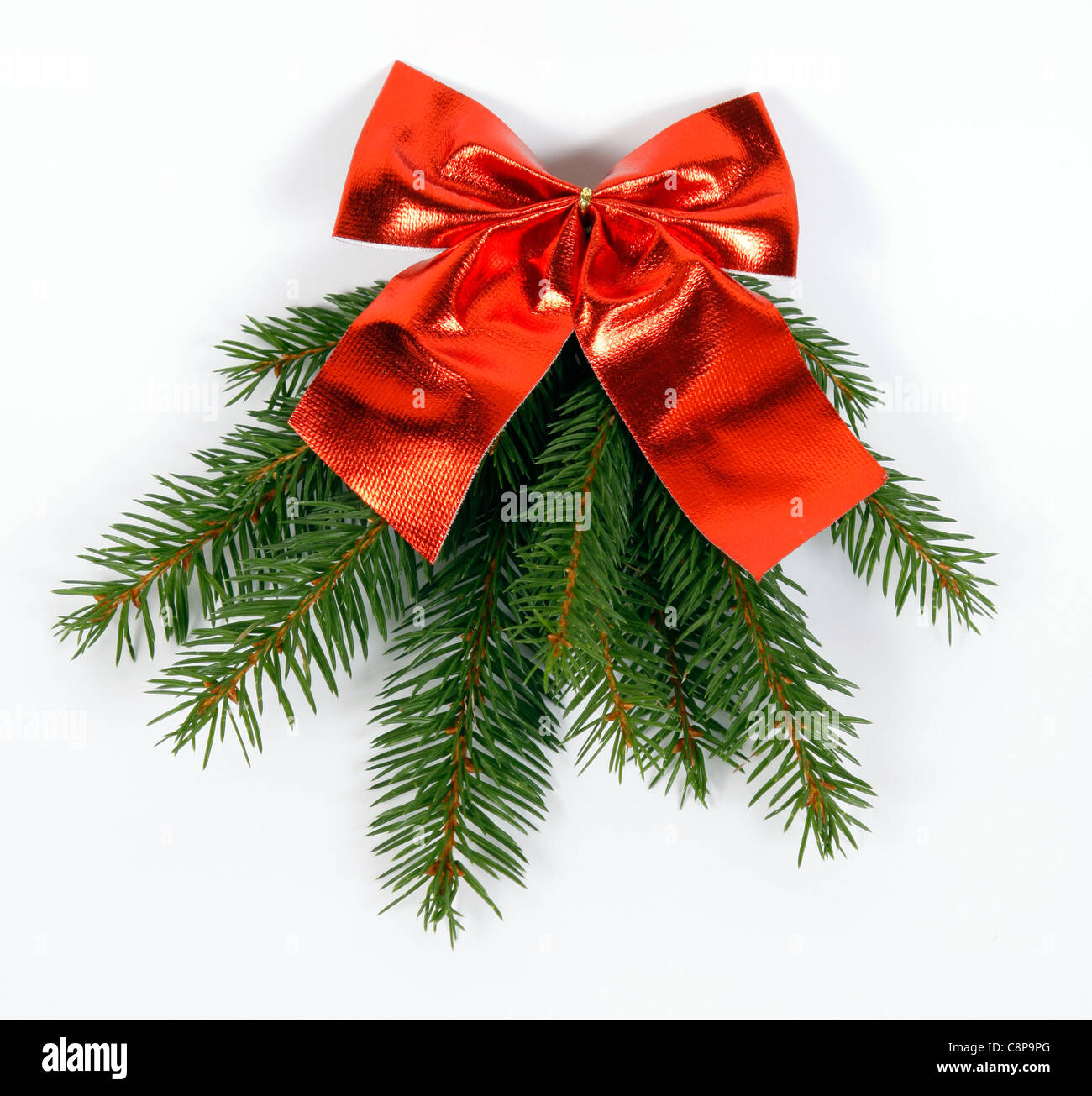 The red big bow on the twigs of the spruce Stock Photo - Alamy
