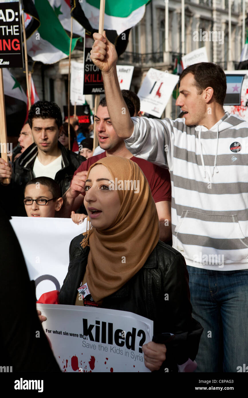 Protesters protest outside the Syrian Embassy in London Stock Photo - Alamy