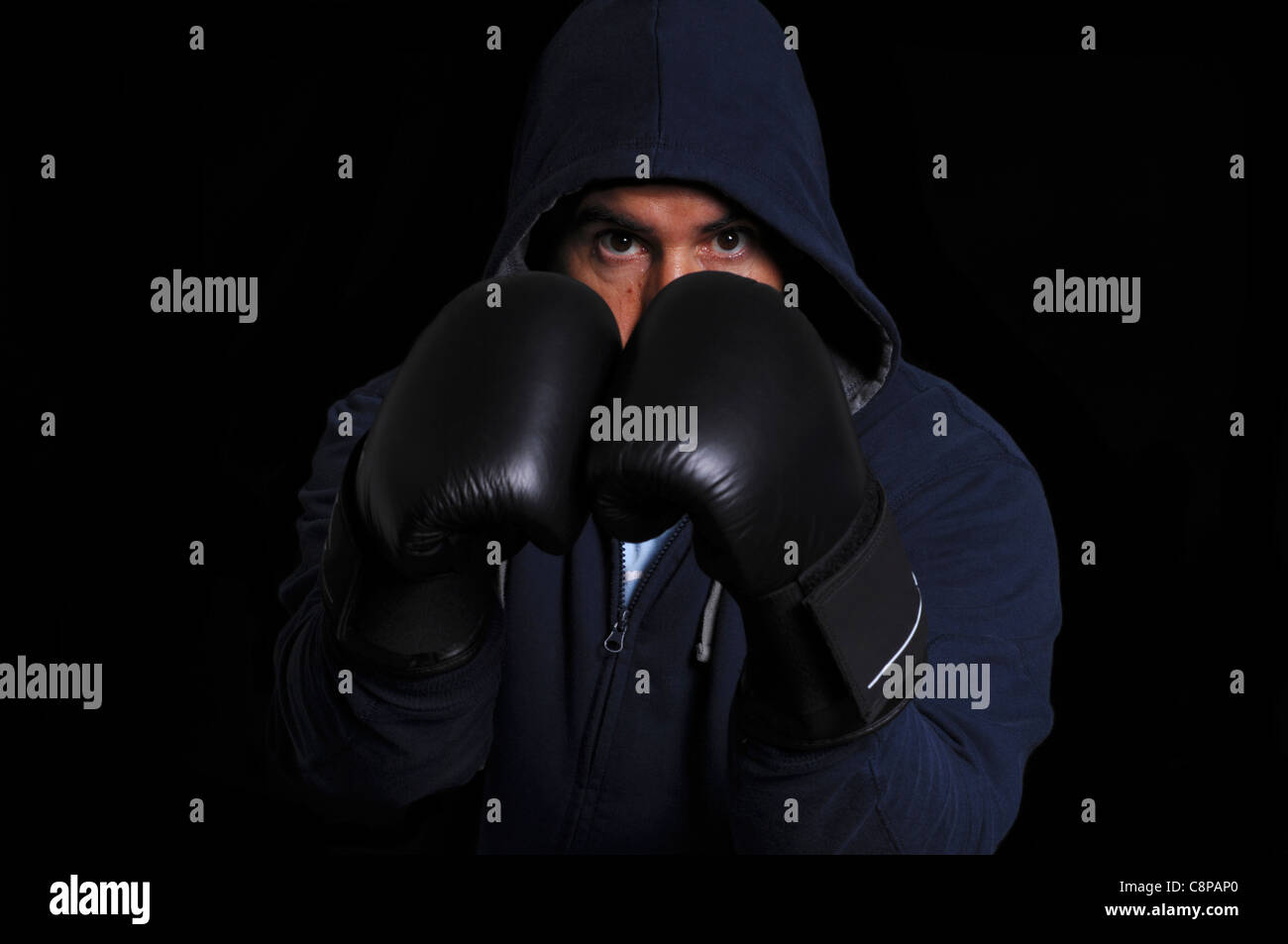 Fighter in training moment on black background Stock Photo - Alamy
