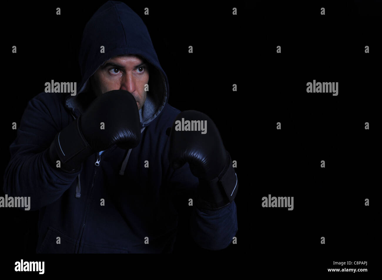 Fighter in training moment on black background and copyspace Stock ...