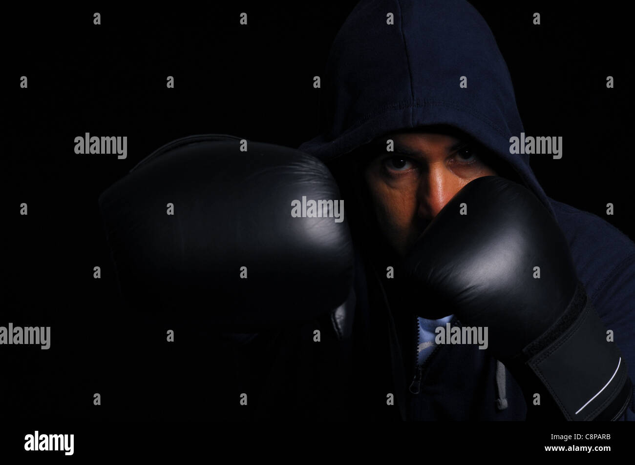 Fighter in training moment on black background Stock Photo - Alamy