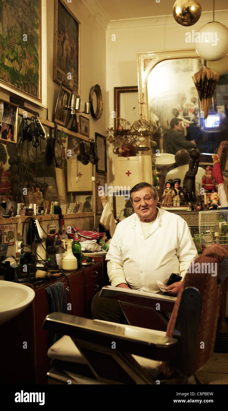 Old fashioned barber in his shop Stock Photo - Alamy