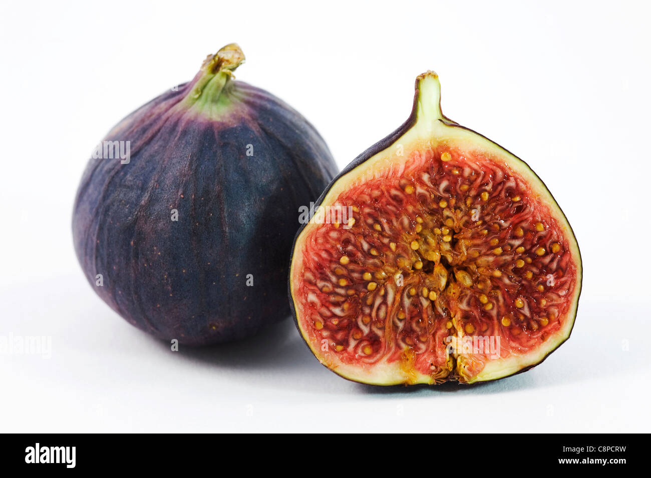 Ficus carica. Black Bursa fig cross section on a white background Stock ...
