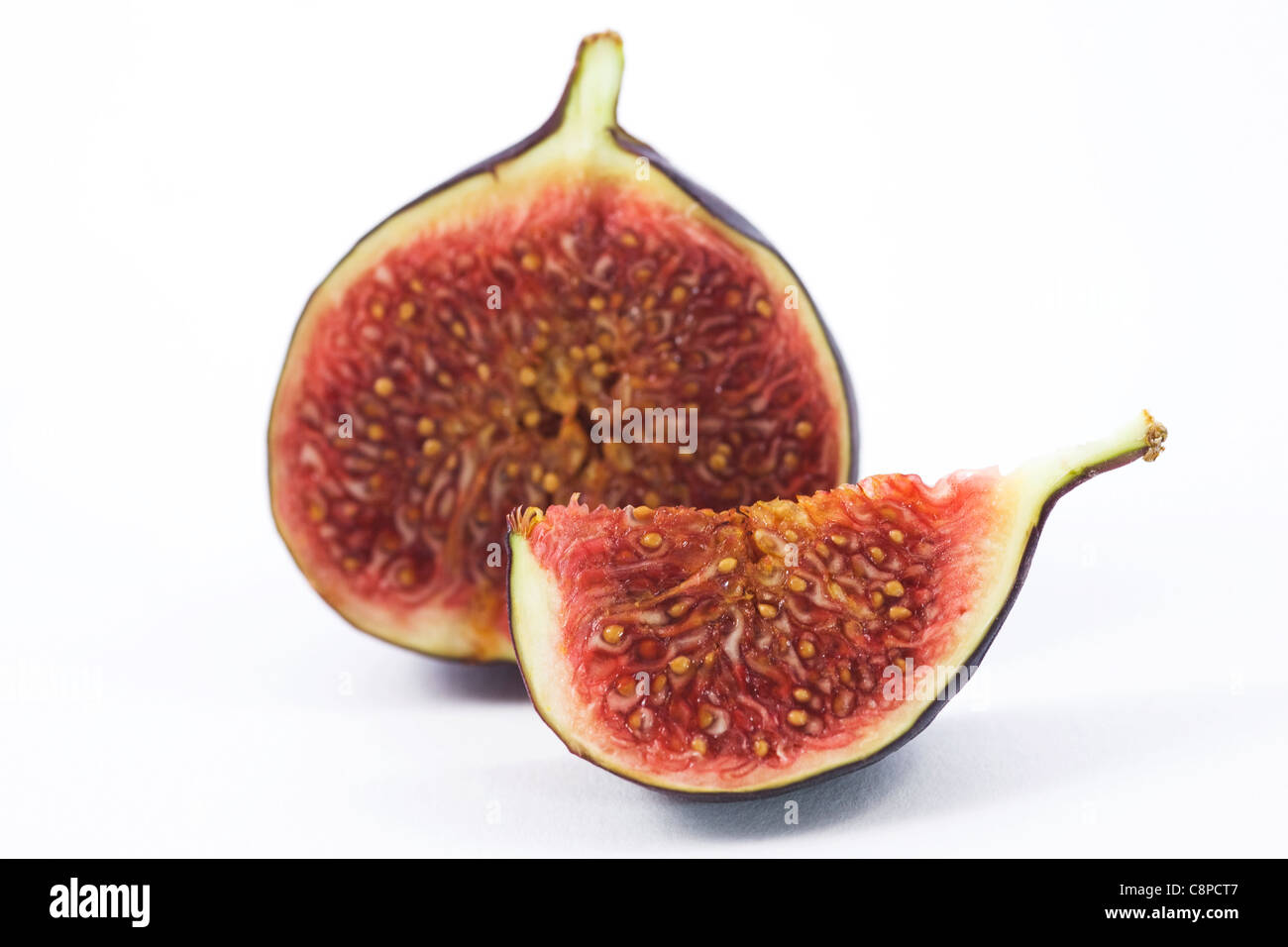 Ficus carica. Black Bursa fig cross section on a white background Stock ...