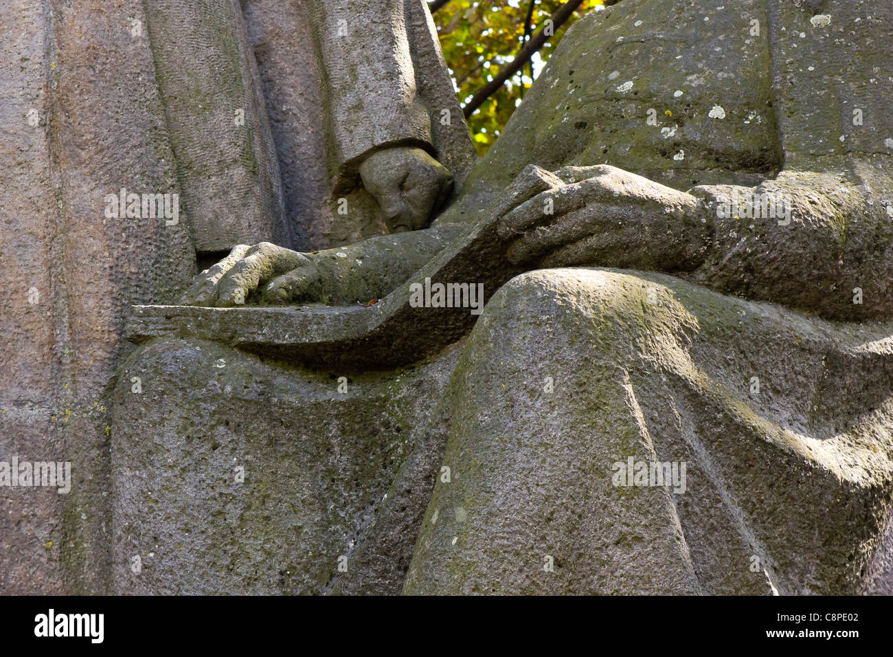 detailed view of a reading stone statue Stock Photo - Alamy