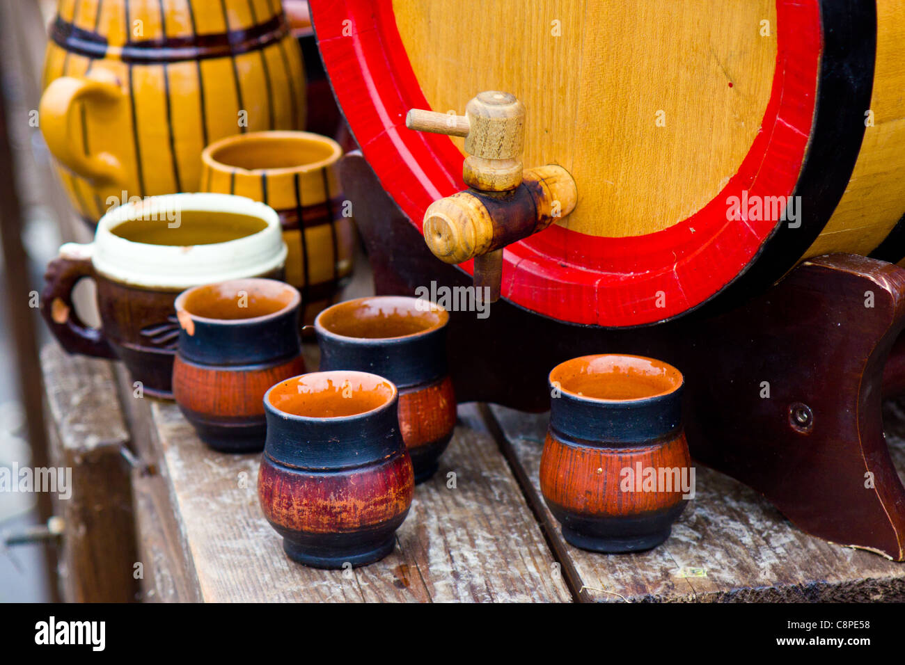 wooden barrel with group of ceramic pottery Stock Photo - Alamy