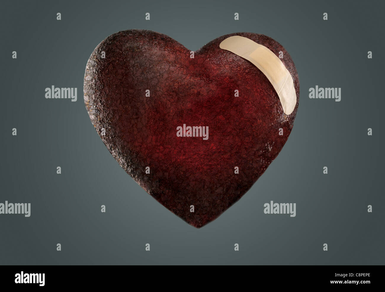 Broken heart with bandage Stock Photo - Alamy
