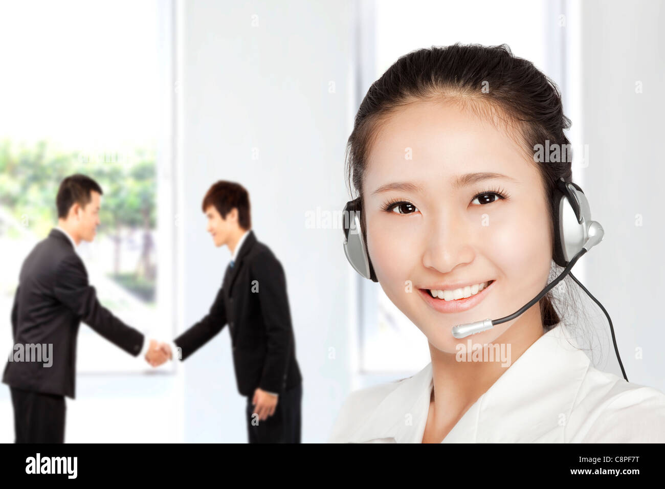 Smiling businesswoman customer service on the phone Stock Photo - Alamy