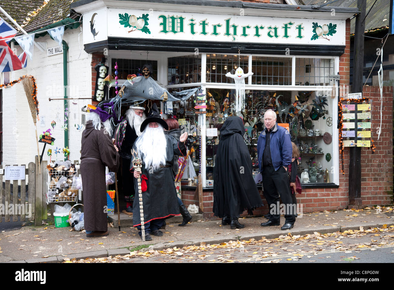 Shop selling witchcraft memorabilia with witches and warlocks outside during Halloween, Burley ...
