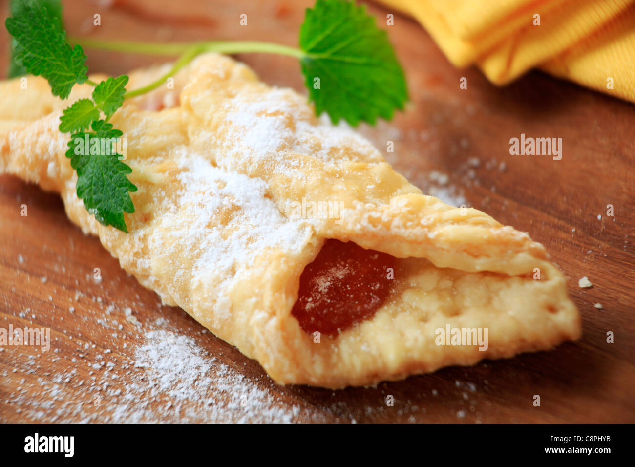Sweet pastry turnover filled with jam - closeup Stock Photo - Alamy
