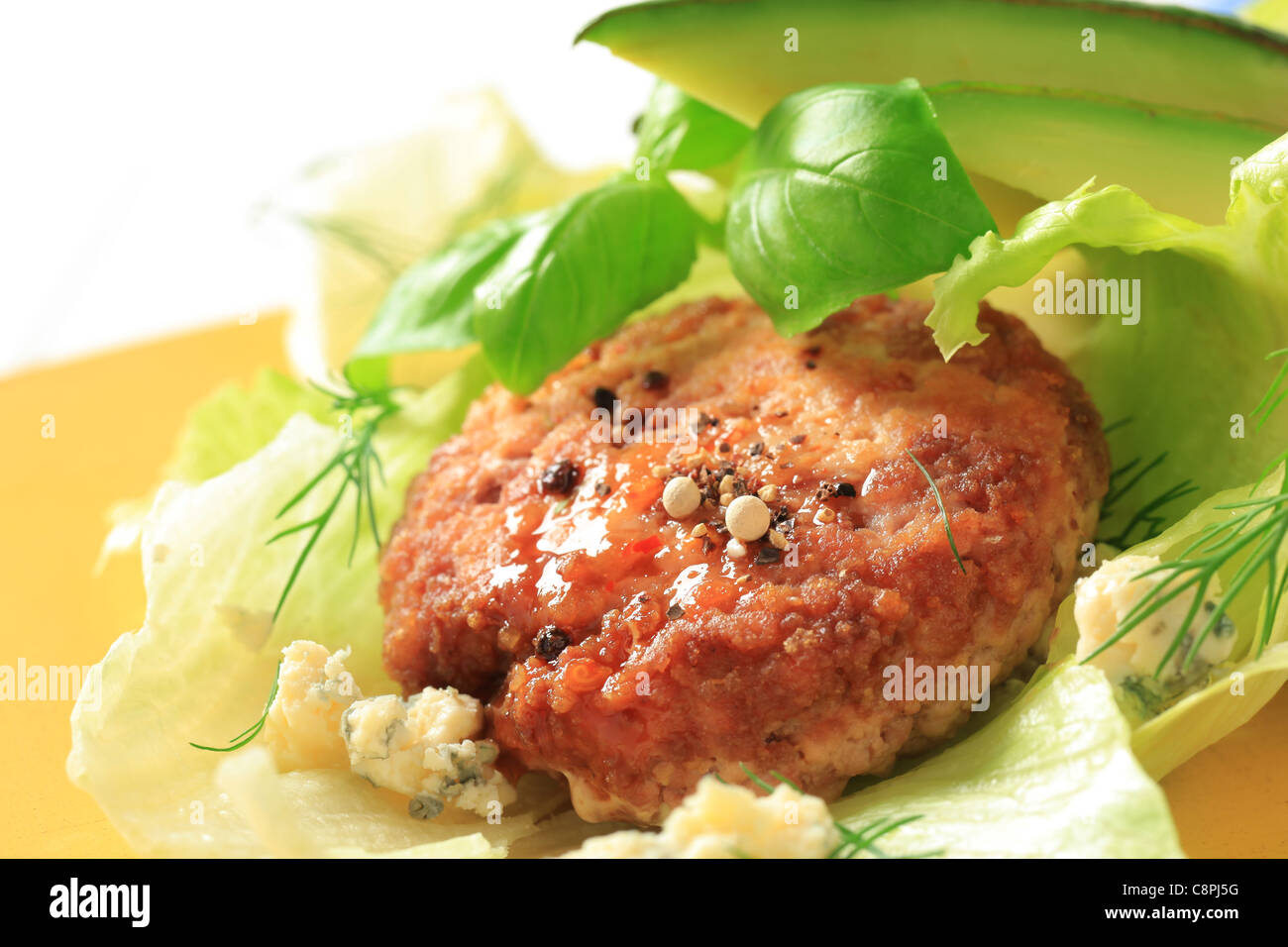 Meat patty with lettuce, avocado and blue cheese Stock Photo - Alamy