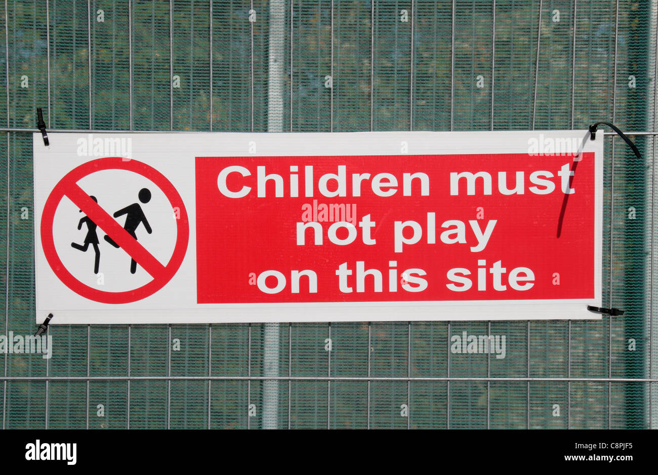 "Children must not play on this site". A British warning sign on a wire ...