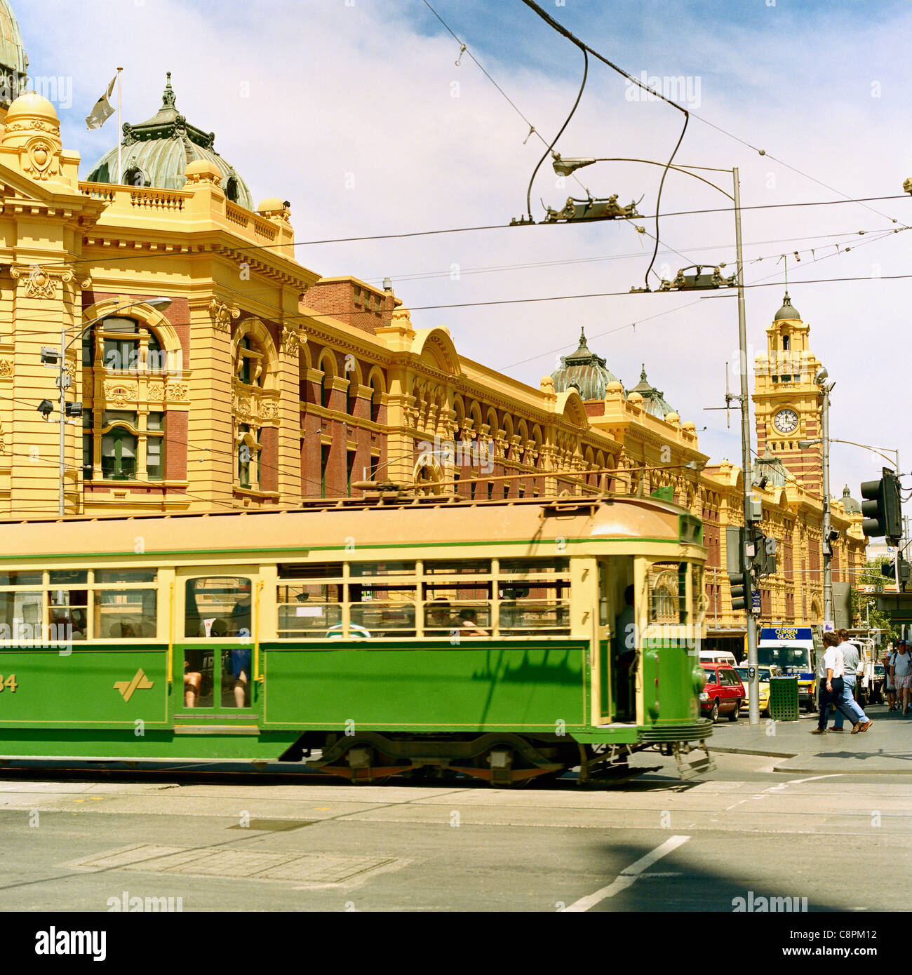 Green tram passing Flinders Street Station Melbourne Australia Stock ...
