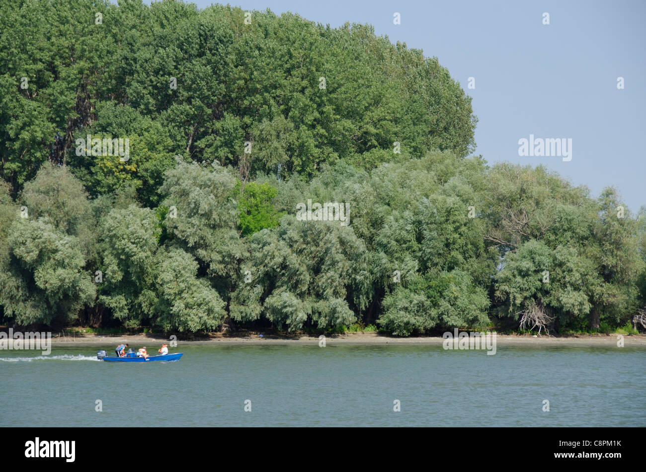 Romania, Dobrudgea region, Tulcea, Danube Delta. Sulina channel lined ...