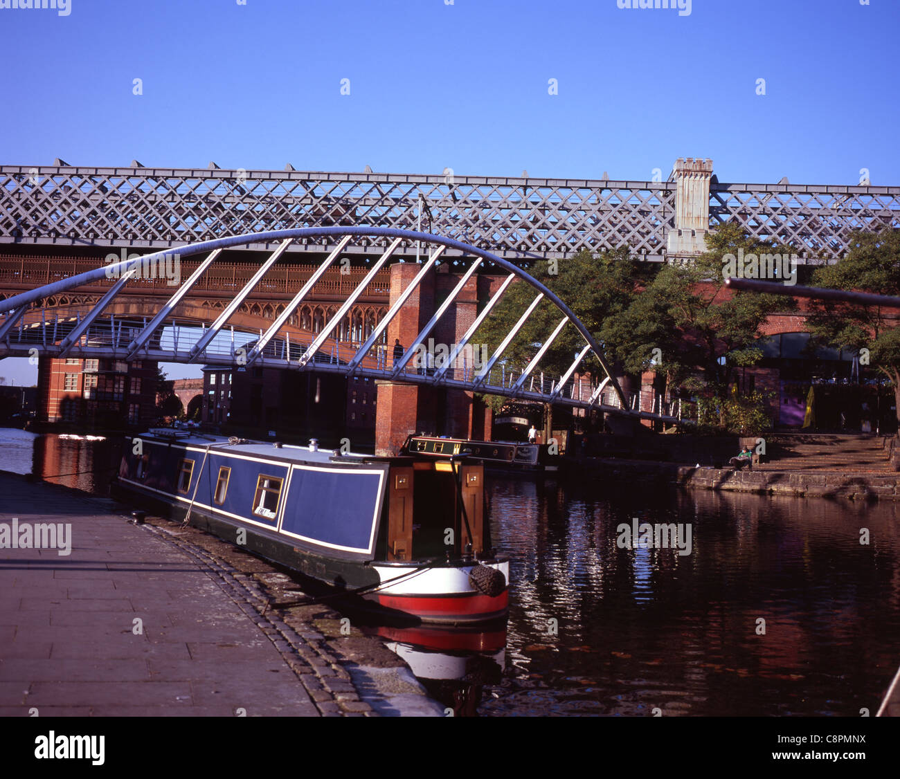 Suspension Bridge and narrow boat at Castlefield Canal Basin ...