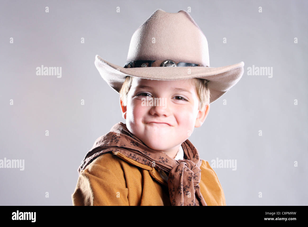 Child cowboy smirking hi-res stock photography and images - Alamy