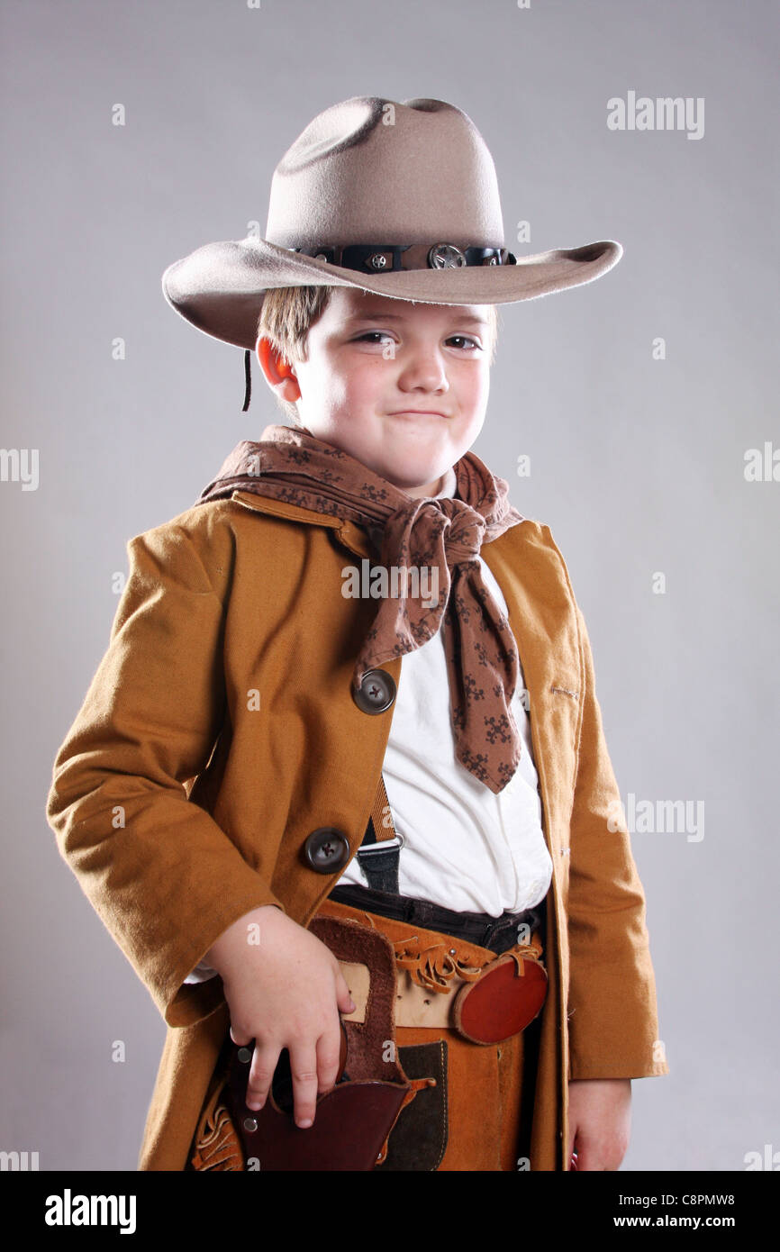 A young cowboy reaching for his gun Stock Photo - Alamy