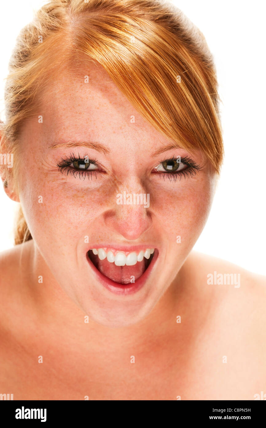 young redhead woman screaming on white background Stock Photo - Alamy