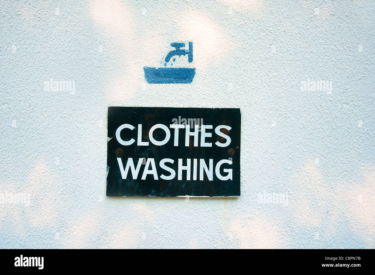 Clothes washing sign Stock Photo - Alamy
