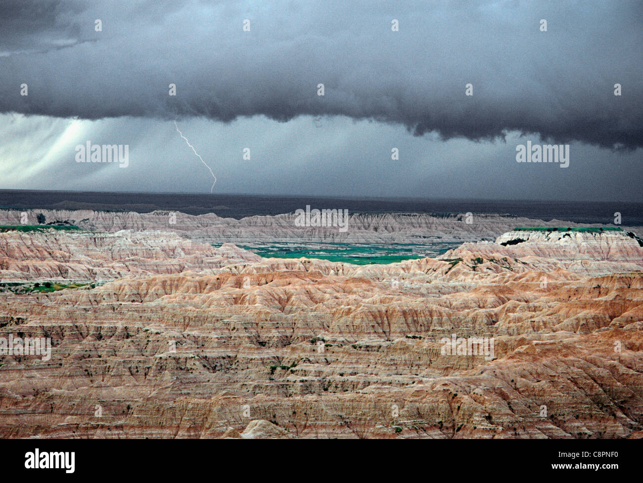 Lightning bolt and storm above sedimentary formations, North Unit ...
